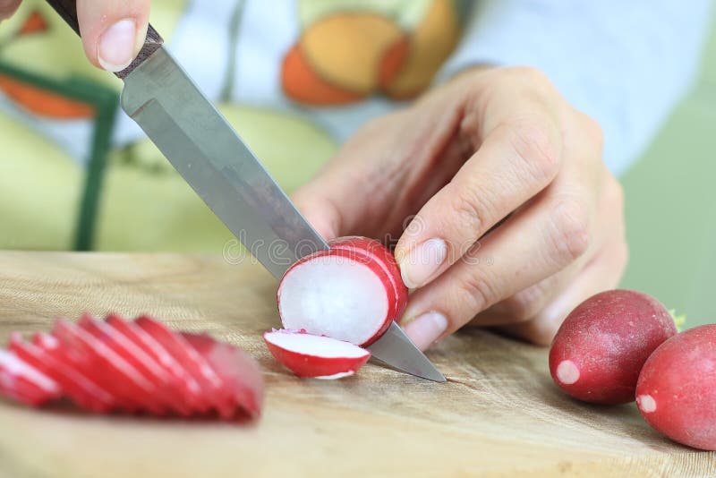 The radishes slice stock photo. Image of plant, hand - 12285396
