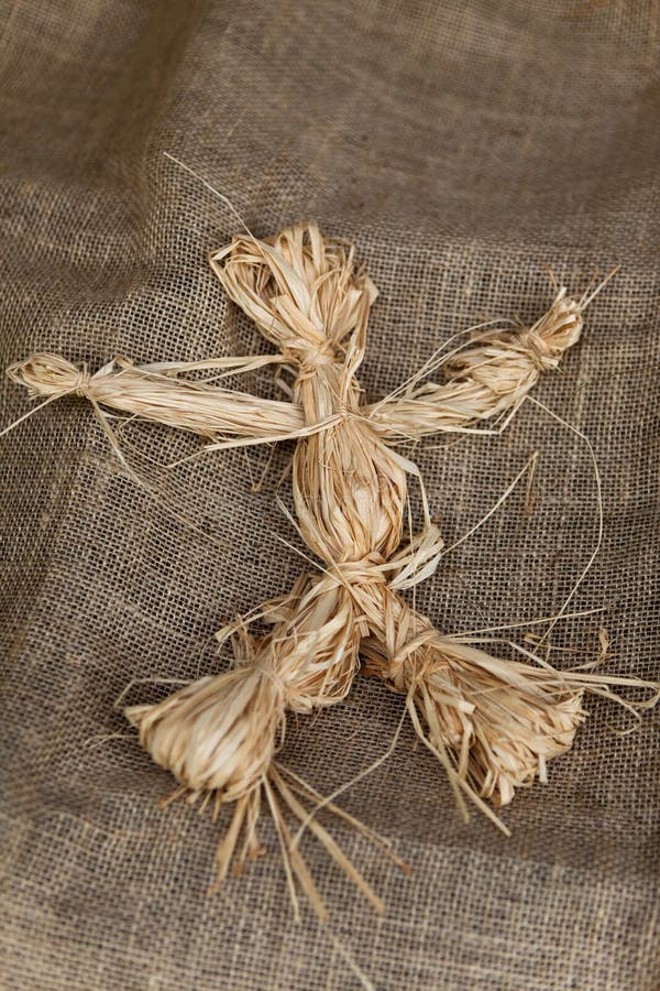 Raffia Doll on a Burlap Fabric Stock Photo - Image of object, raffia ...