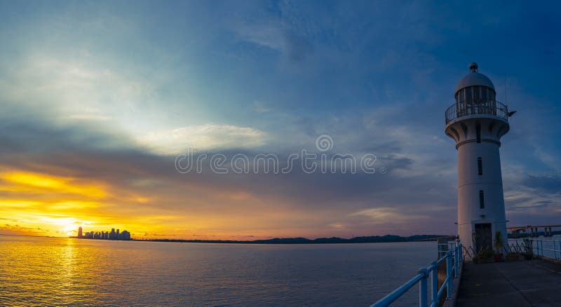 Raffles Marina Lighthouse and Forrest City at Sunset Stock Image ...