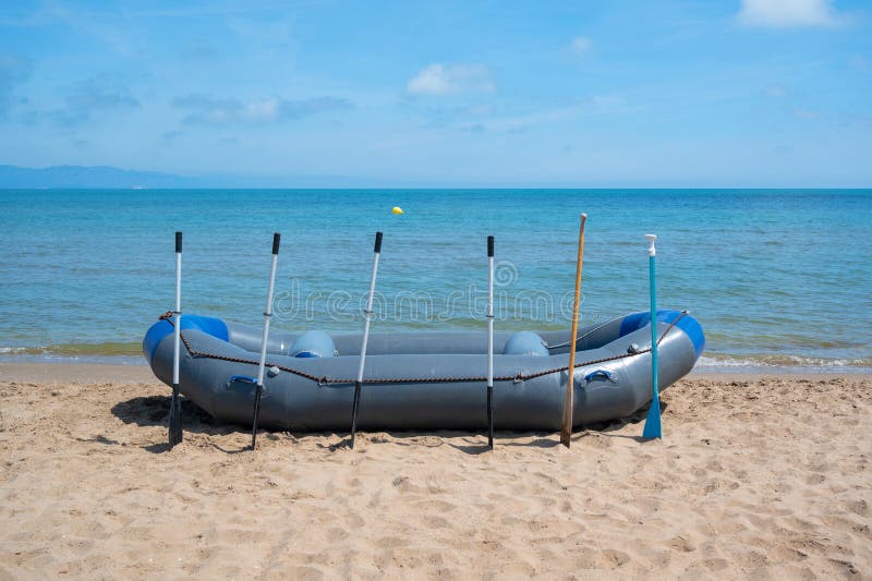 A Raft with Oars on the Beach, Ready for Nautical Activities Stock ...