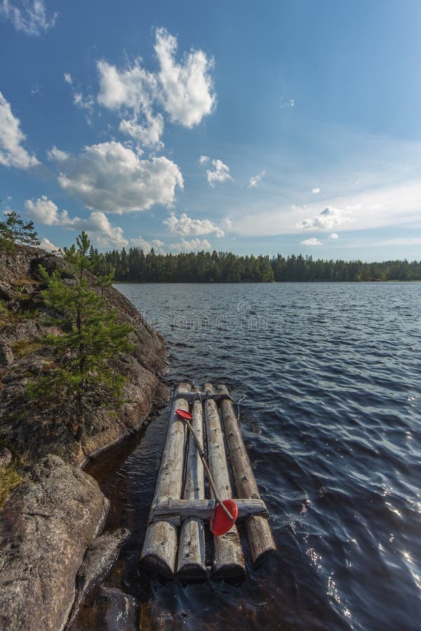 Raft at the rocky shore stock photo. Image of lake, beauty - 32184392