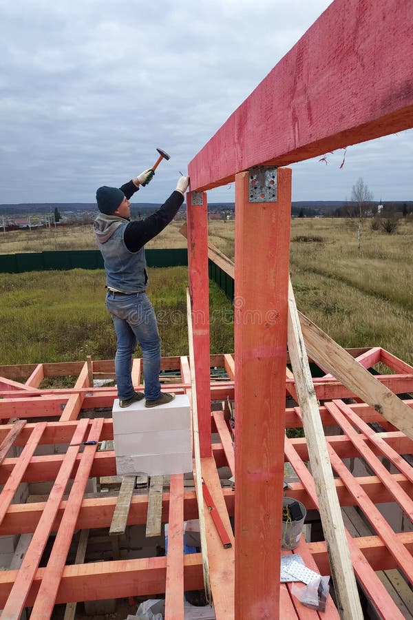 Rafters Wooden Against the Blue Sky, the Master is Working on the ...