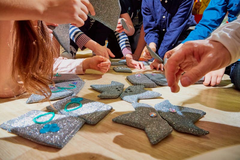 Rag Puzzle Pieces and Children`s Hand Linking Them Stock Image - Image ...
