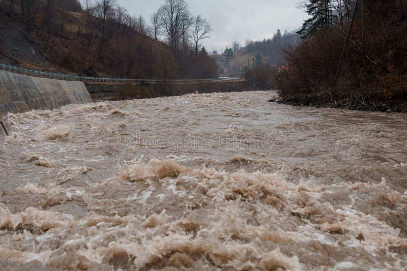 Raging River Amidst a Gloomy Landscape after Heavy Rainfall Stock Photo ...