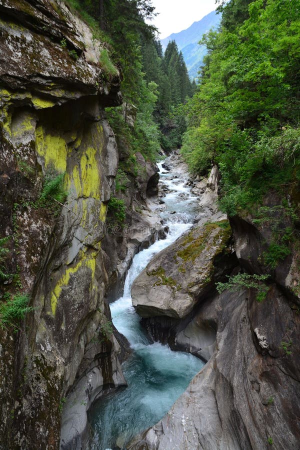Raging River in the Middle of a Rocky Cliff Stock Photo - Image of ...
