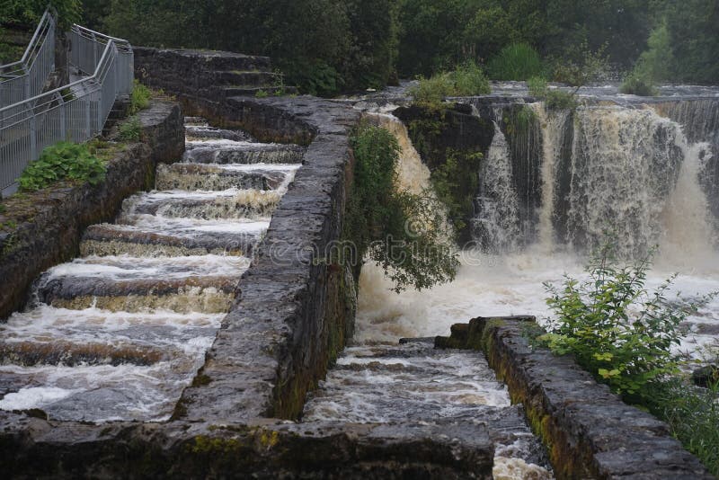 Raging Water of a Waterfalls Running through Steps Going into a Stream ...