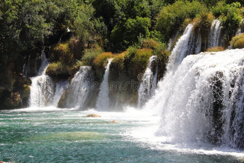 Raging Waterfalls Surrounded by Trees and Rocks Stock Photo - Image of ...