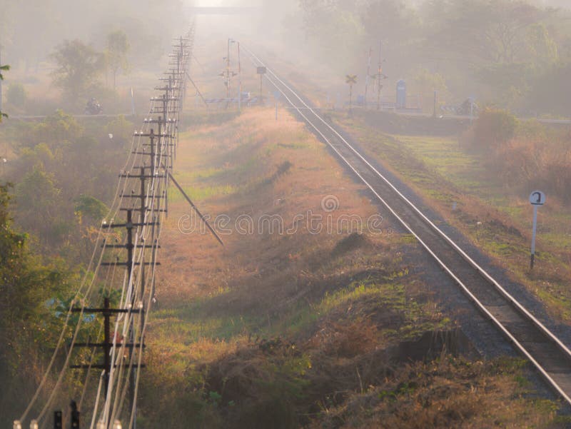 Rail Pole Parallel To the Train Rail on the Fog Day Stock Photo - Image ...
