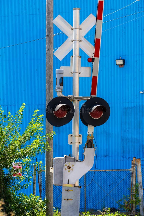 Rail Road Signal Pole and Gate Against Blue Wall Stock Photo - Image of ...
