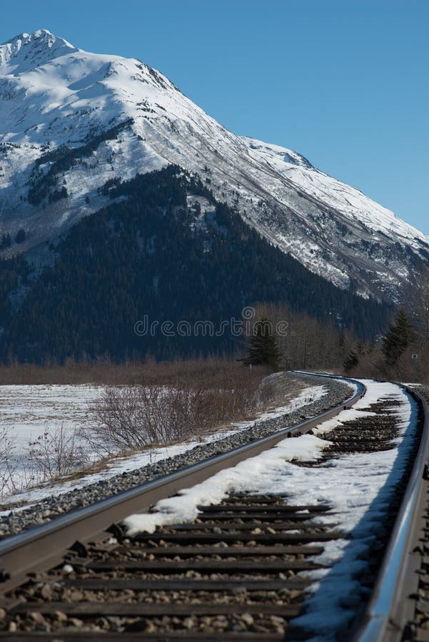 Rail and snowy mountain stock photo. Image of backdropn - 48021676