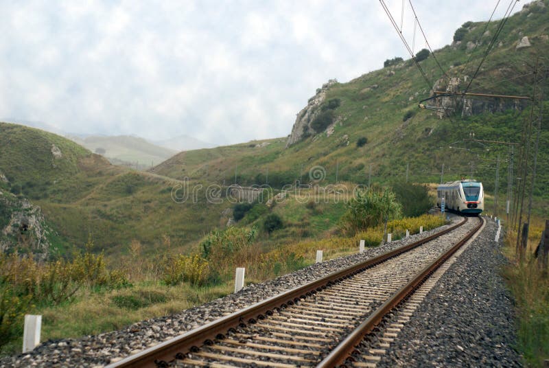 Rail train in countryside stock image. Image of engine - 10367817