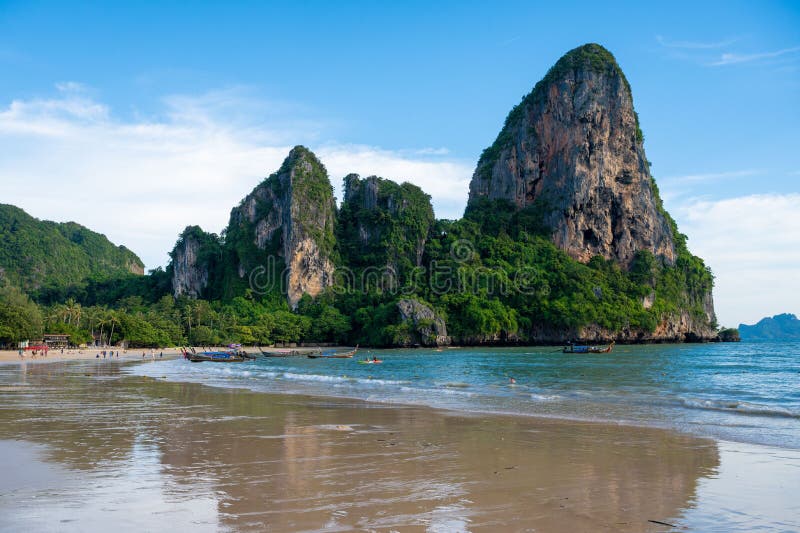 Railay Beach with Large Cliffs and Greenery Stock Image - Image of ...