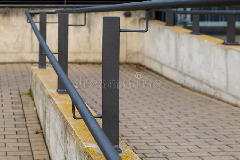 A railing on a footpath stock image. Image of walk, exterior - 306246439