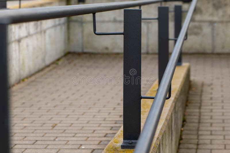 A railing on a footpath stock image. Image of construction - 306246457