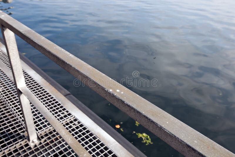Railing by water stock image. Image of green, rail, water - 85276211