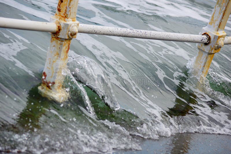 Railing and water 3 stock image. Image of nicephoto, water - 53390109