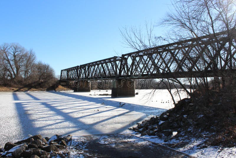 Railroad Bridge Over a Frozen Winter River Stock Photo - Image of ...
