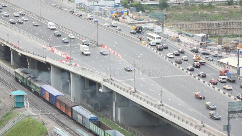 Railroad Cargo Train Under Bridge with Moving Stock Footage - Video of ...