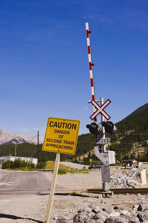 Railroad Crossing Arm and Caution Sign Stock Photo - Image of sign ...
