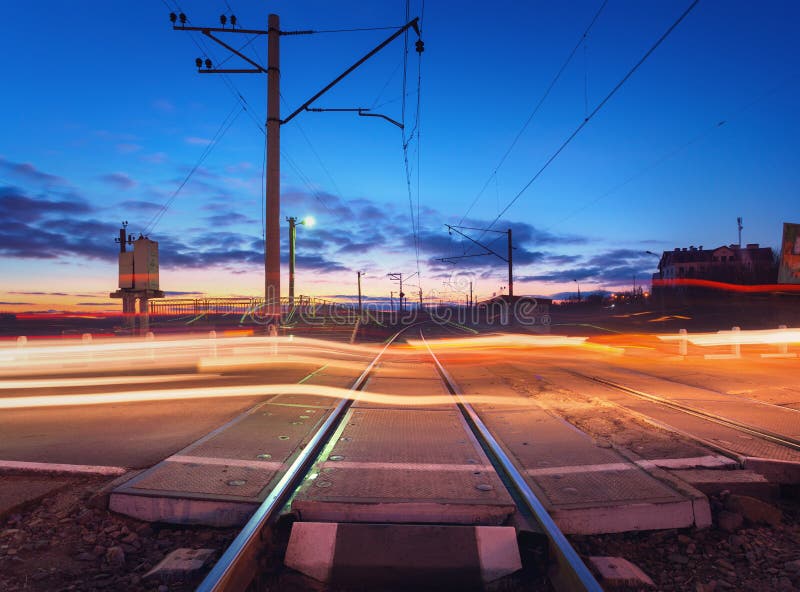Railroad Crossing with Car Lights in Motion at Night Stock Photo ...