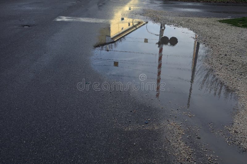 Railroad Crossing Casted in a Puddle Stock Photo - Image of cloudy ...
