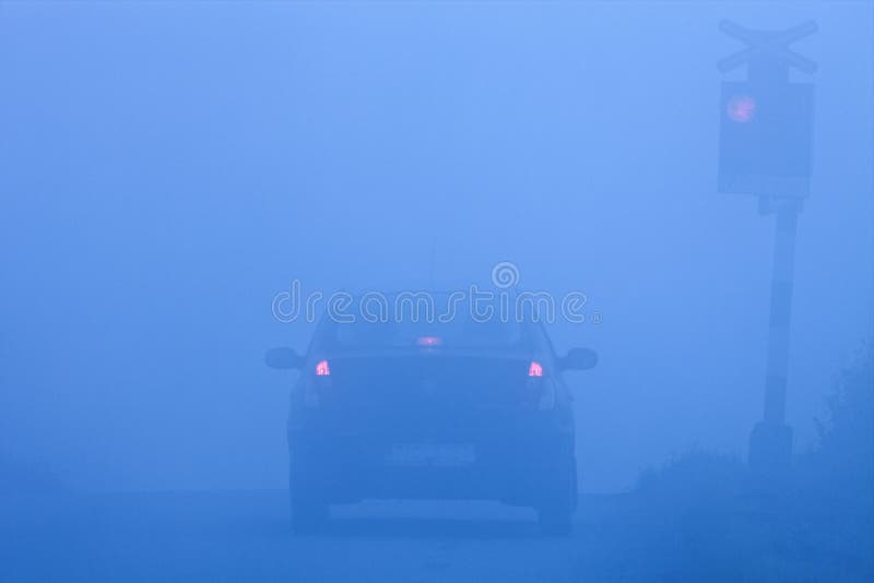 Railroad crossing in fog stock photo. Image of danger - 16060972
