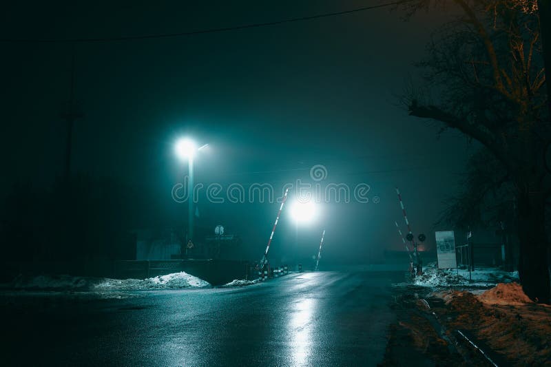 Railroad Crossing at Night during Fog, Winter Stock Image - Image of ...