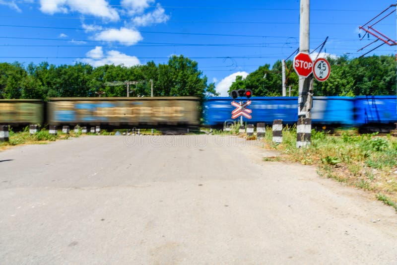 Railroad Crossing Sign and Blinking Semaphore in Front of the Railroad ...