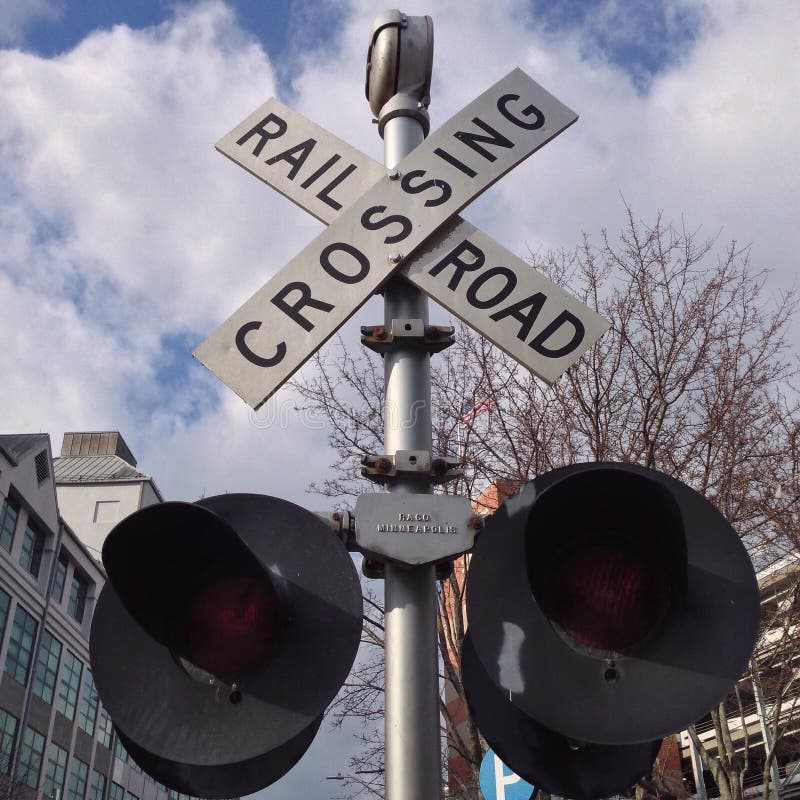 Railroad crossing at night stock photo. Image of barrier - 67726058