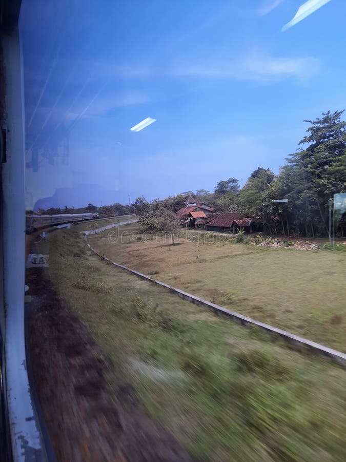 The Railroad Locomotive Captured from the Back Carriage of a Boarded ...