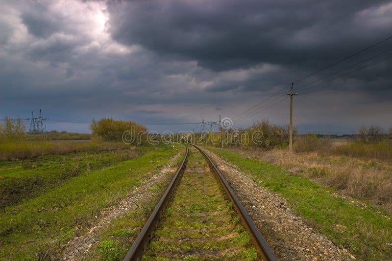 Railroad Near High Voltage Power Lines at Dramatic Sky Stock Image ...