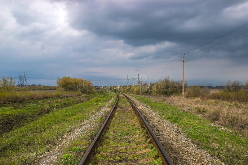 Railroad Near High Voltage Power Lines at Dramatic Sky Stock Image ...