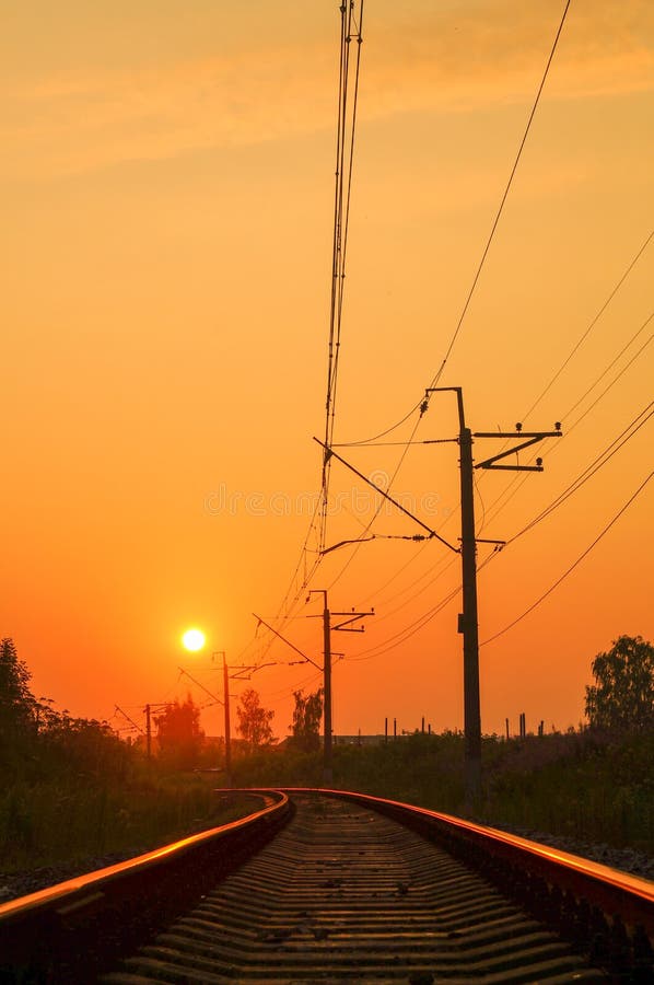 Railroad - Railway at Sunset with Sun Stock Photo - Image of heavy ...