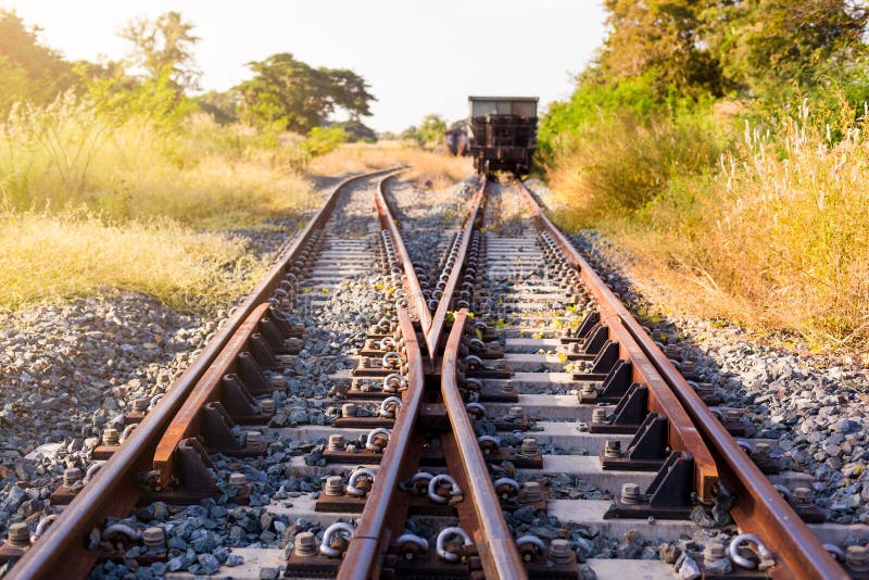 Railroad Switch with Train in the Morning Sun. the Conception of Stock ...
