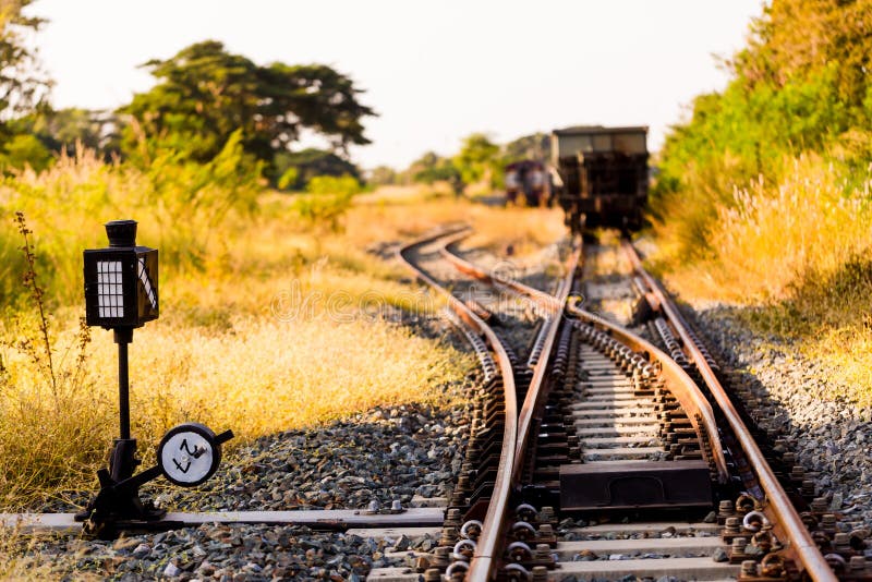 Railroad Switch with Train in the Morning Sun. the Conception of Stock ...