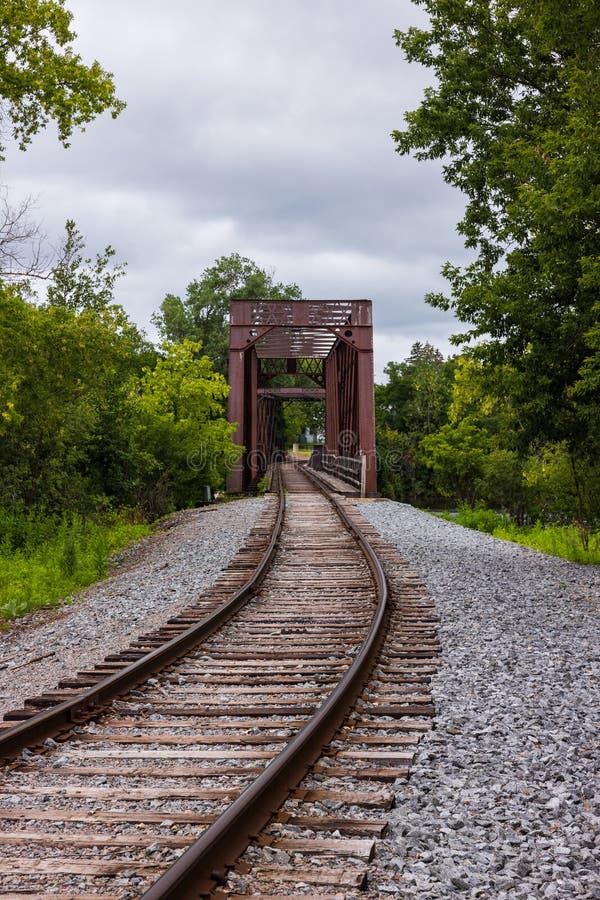 A Railroad Track Crossing Old Railroad Bridge Stock Photo - Image of ...
