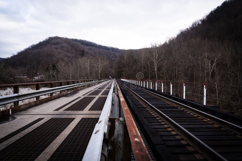 Railroad Tracks on Bridge with Mountain Backdrop Stock Image - Image of ...