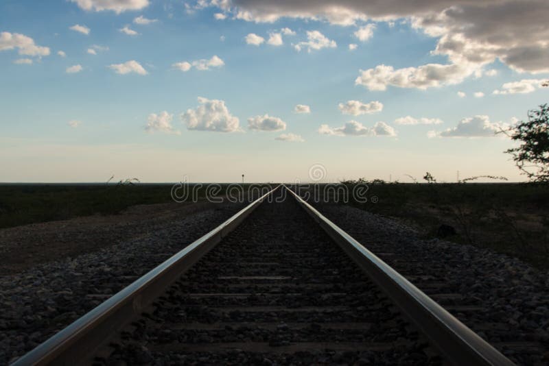 Railroad tracks converging stock photo. Image of flat - 96572714