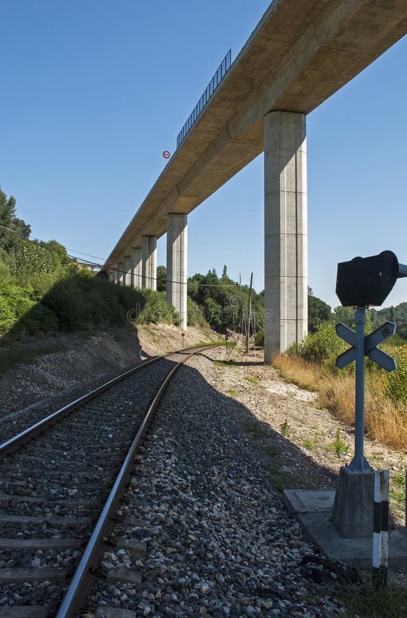Railroad Tracks Crossing Elevated Highway Stock Photo - Image of ...