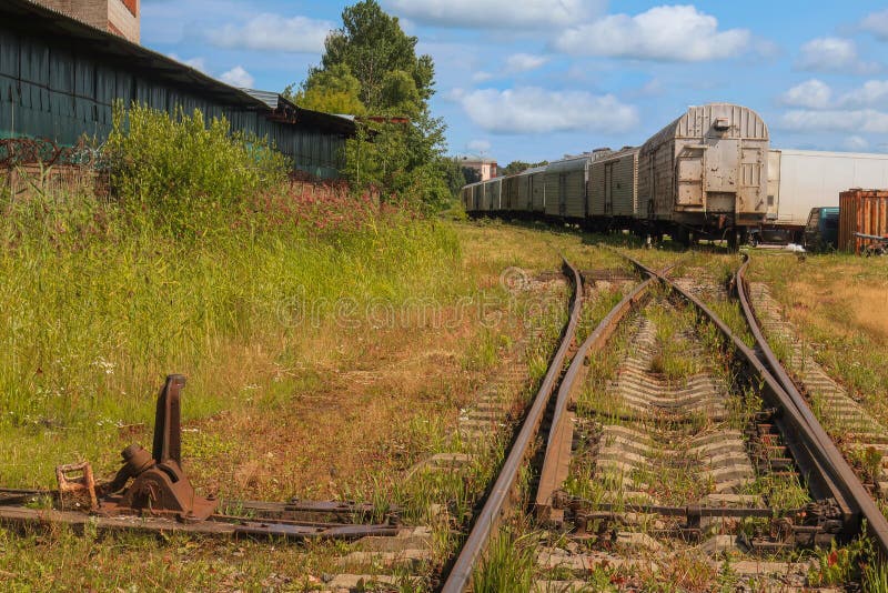 Railroad Tracks in Hand Arrow Stock Image - Image of hand, logistic ...
