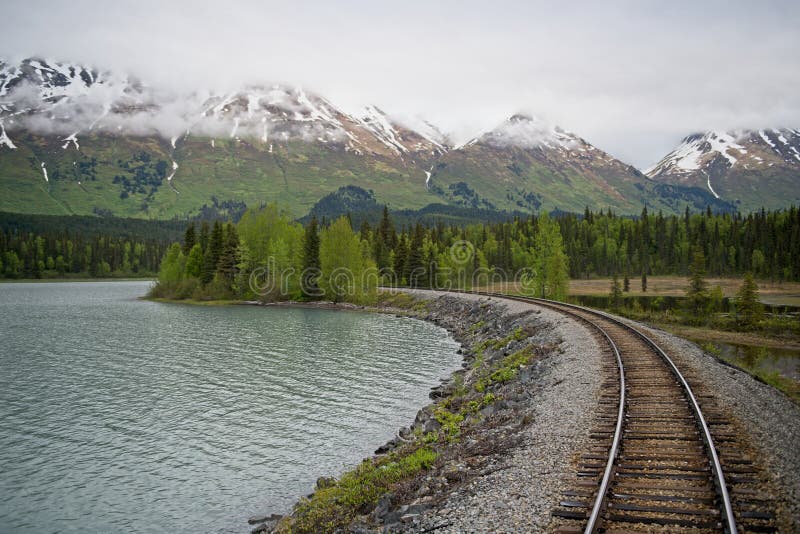 Railroad Tracks Landscape with Alaska Mountain Ranges and Lakes Stock ...