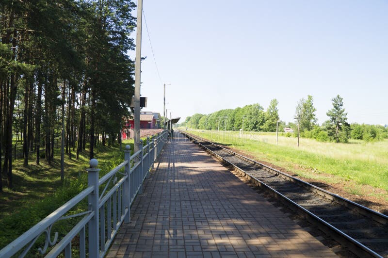 Railroad Tracks on a Small Railway Station Stock Image - Image of blue ...