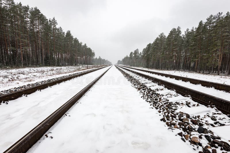 Railroad Tracks in Snowy Winter Day Stock Photo - Image of space, scene ...