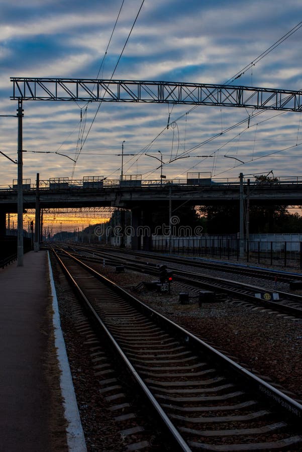 Railroad tracks at sunset stock photo. Image of container - 87132492