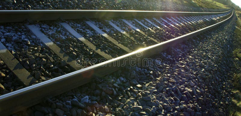 Railroad Tracks in Interesting Long Perspective with Sun Shining from ...
