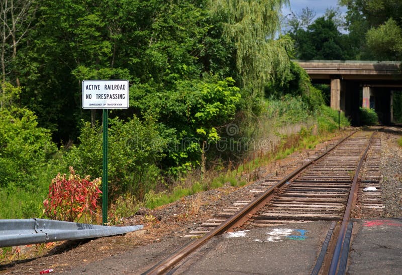 Railroad Tracks Warning Sign Stock Image - Image of overpass, freeway ...