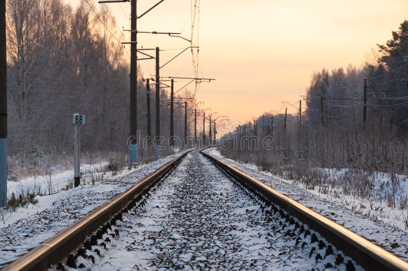 Railroad Tracks in the Winter Forest at Sunset Stock Image - Image of ...