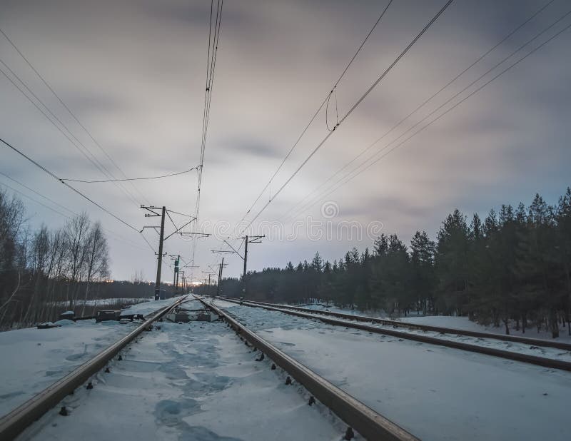 Railroad Tracks on a Winter Night, Railroad Tracks and City Lights in ...