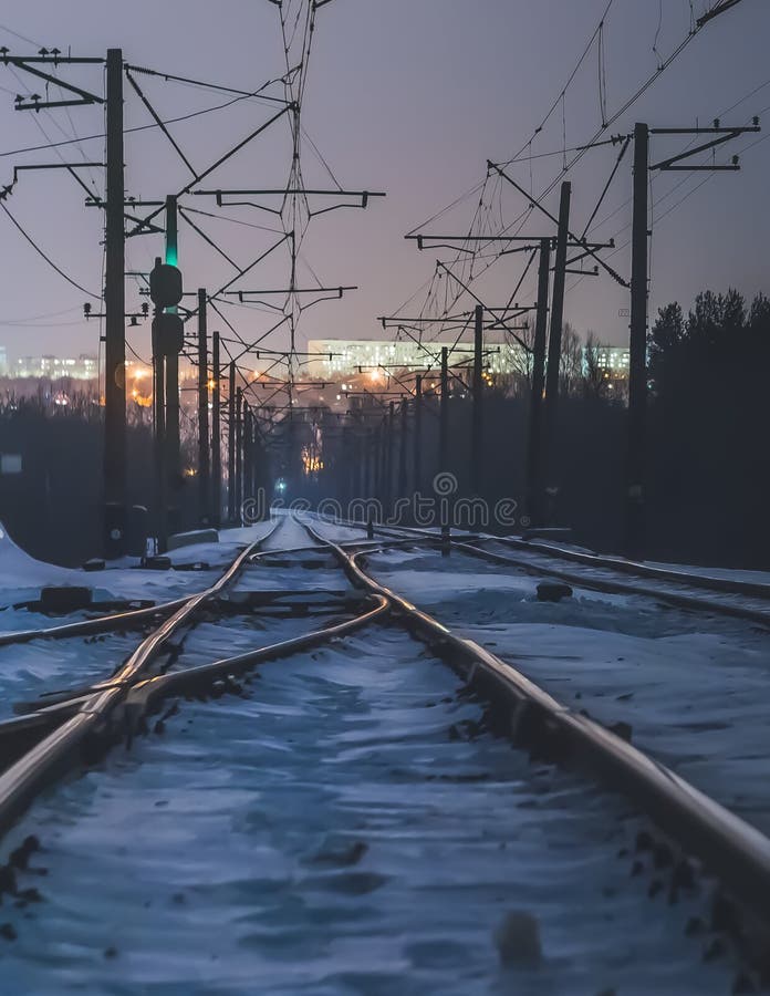 Railroad Tracks on a Winter Night, Railroad Tracks and City Lights in ...