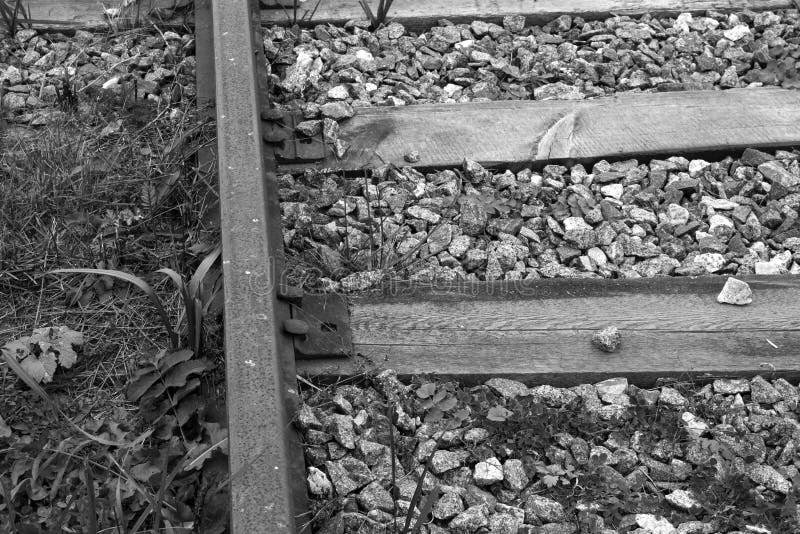 A Railway with Rails and Concrete Sleepers.Background of an Old Rusty ...
